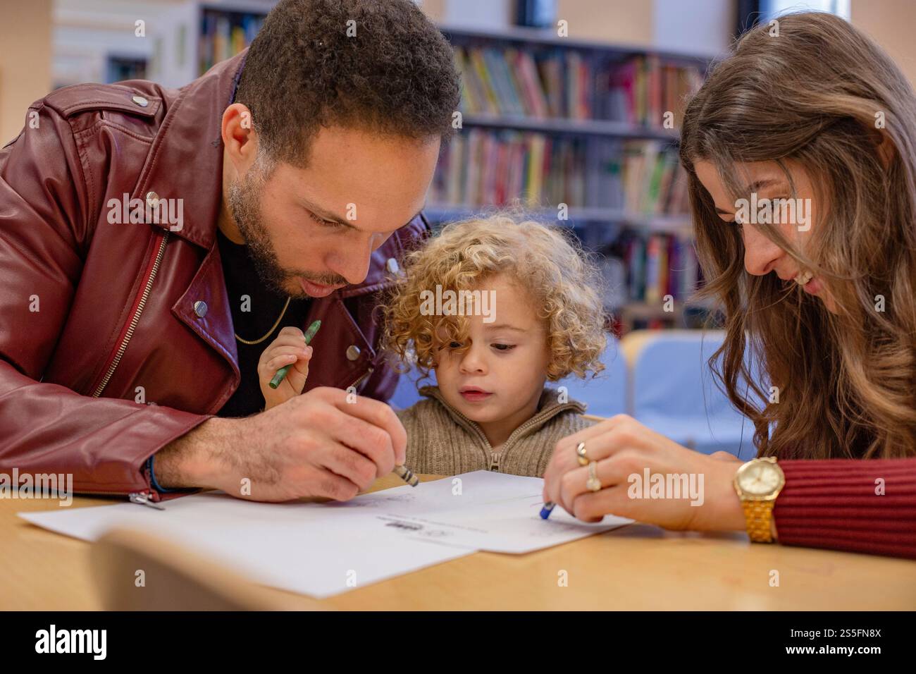 Focused intently on writing hi-res stock photography and images - Alamy