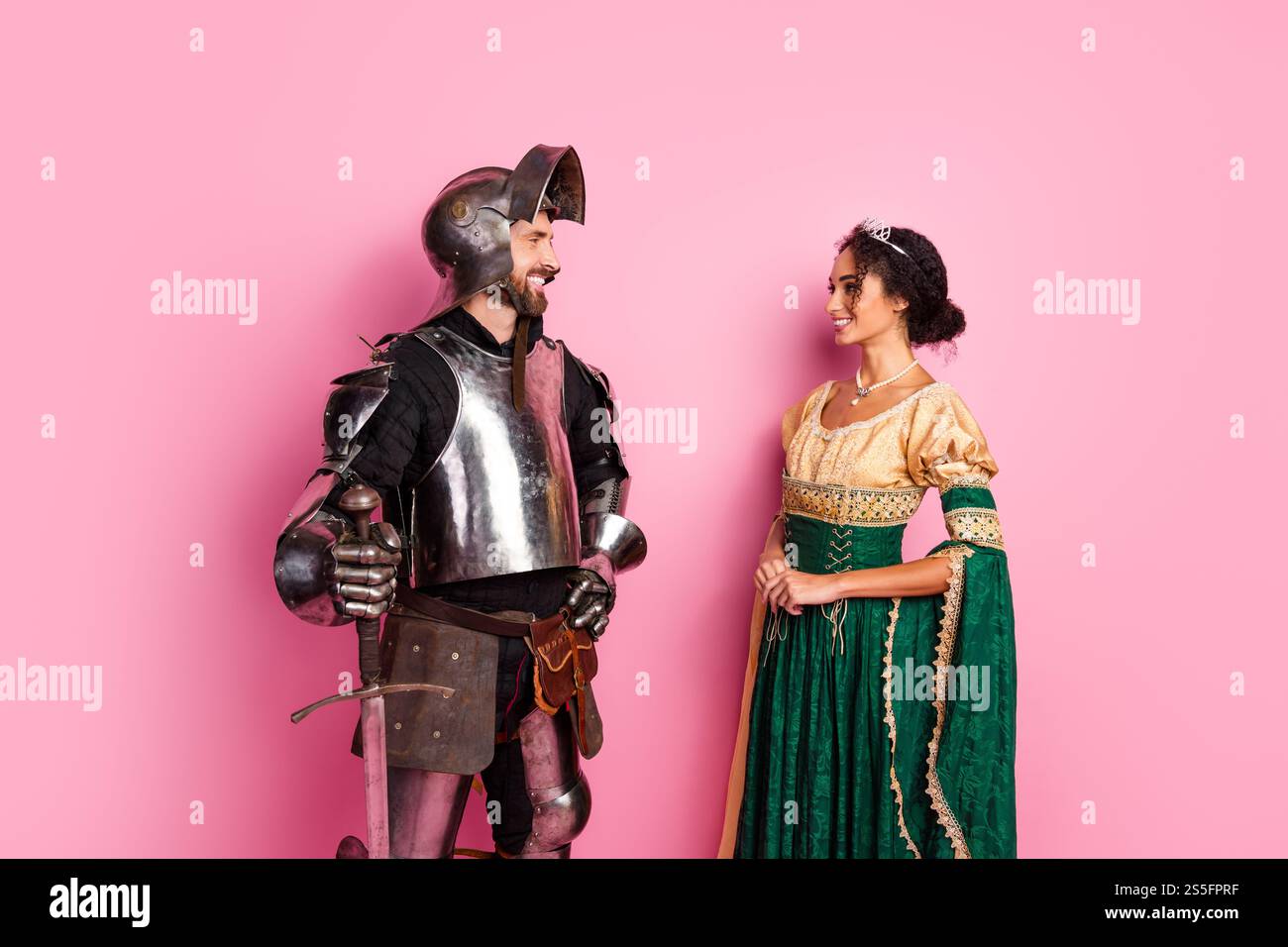 A knight in armor and a lady in a medieval dress sharing a conversation ...