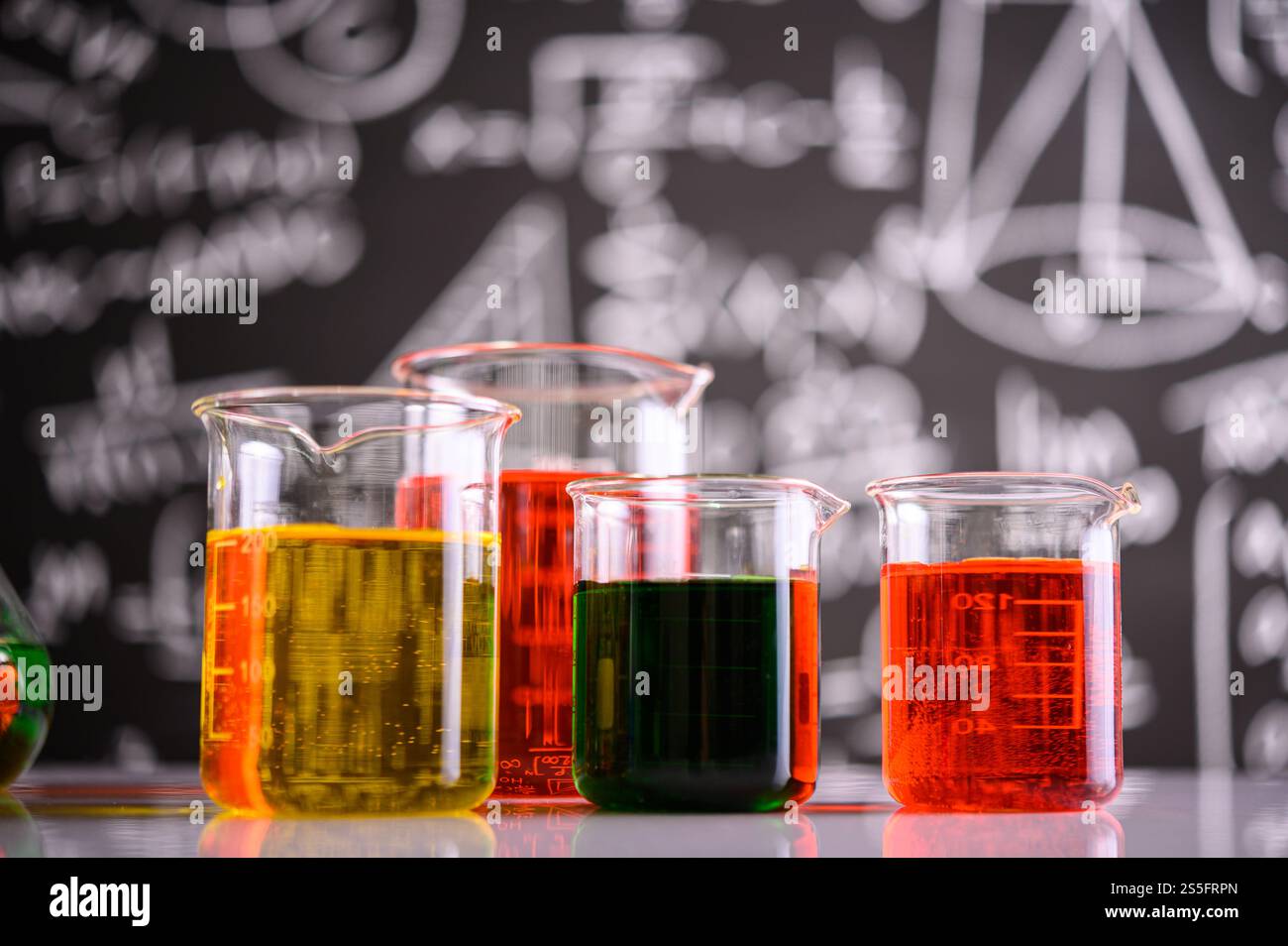 Laboratory glassware with liquids of different color Stock Photo - Alamy