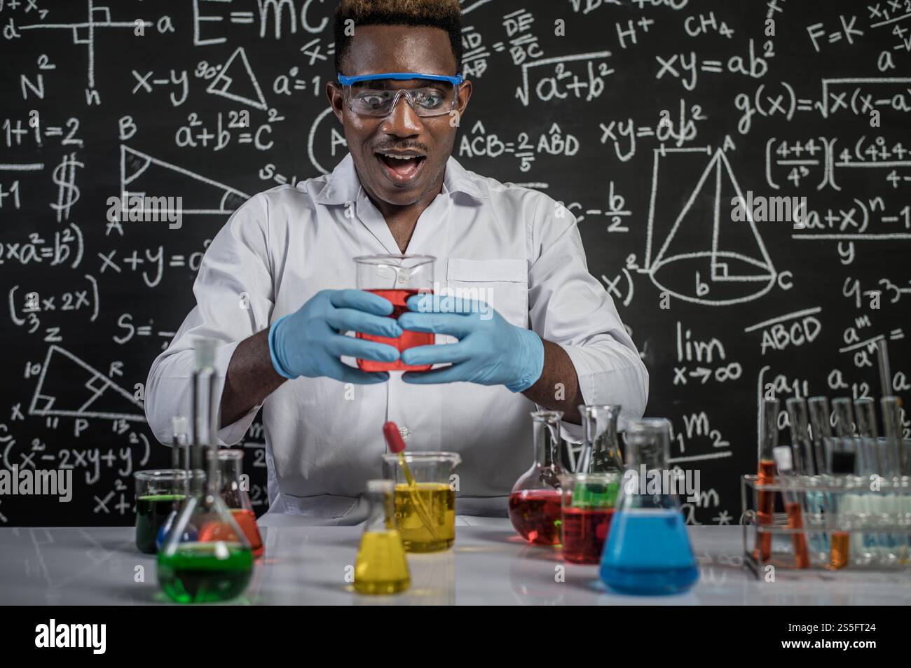 Scientists startled at the red chemical in the glass at the laboratory ...