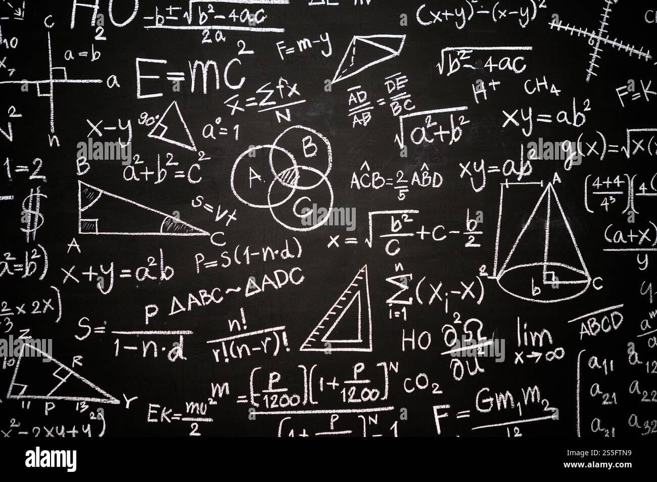 Blackboard inscribed with scientific formulas and calculations in ...