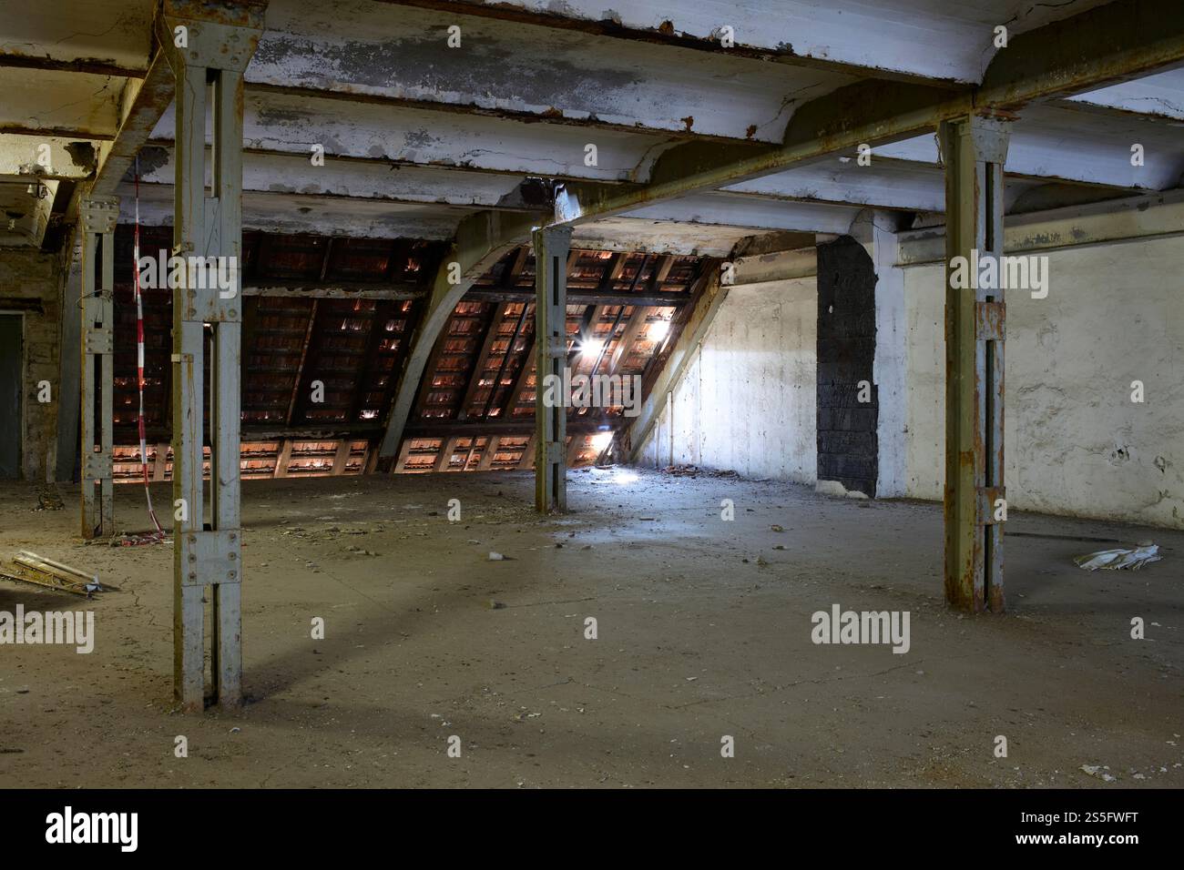 Abandoned industrial building interior with weathered beams and ...