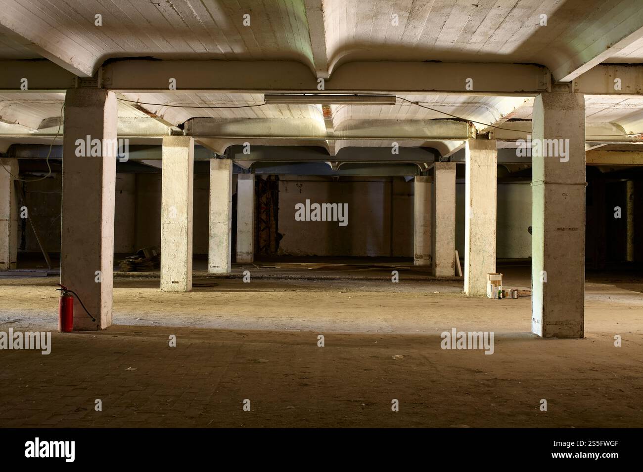 NA Abandoned industrial warehouse interior with sunlight streaming ...