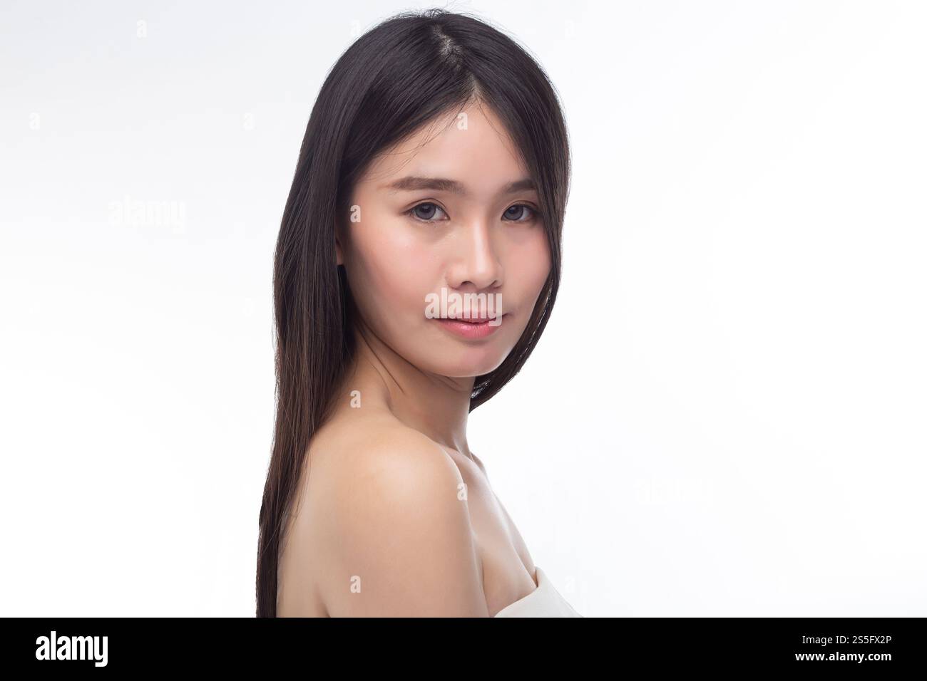 The women wear white strapless tops and face to the right Stock Photo ...