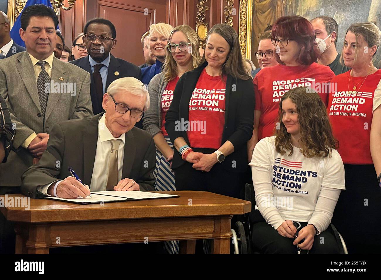 Wisconsin Gov. Tony Evers signs an executive order, Tuesday, Jan. 14 ...
