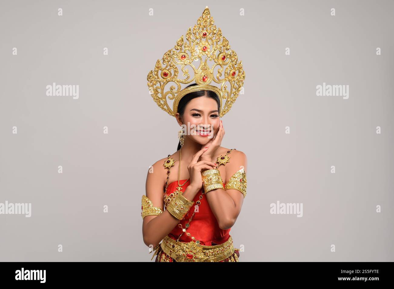 The girl wears Thai dress and hands touch the face Stock Photo - Alamy