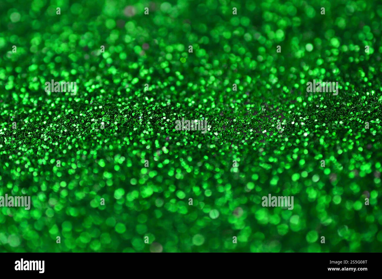 A huge amount of green decorative sequins. Background image with shiny ...