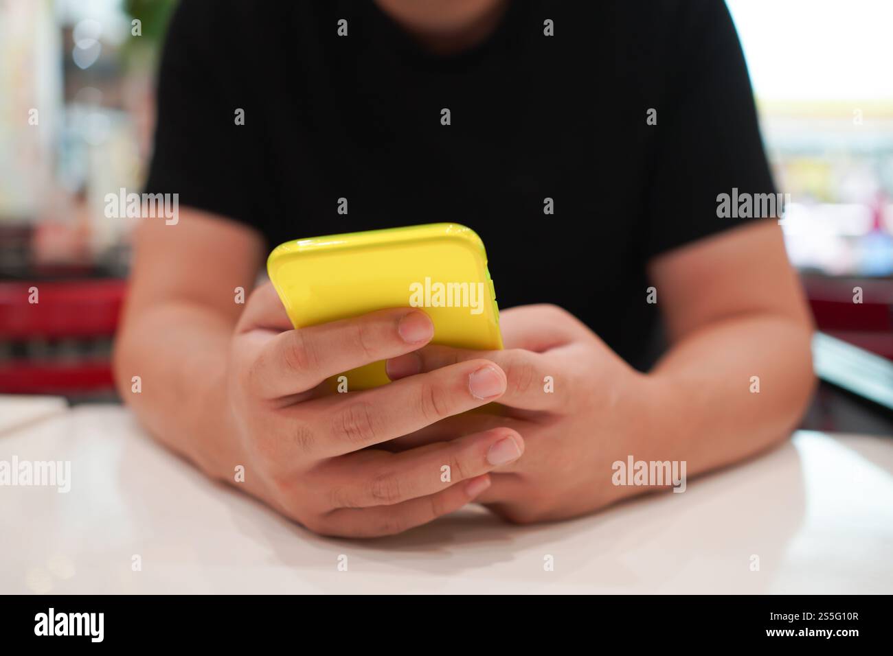 Man playing game on mobile phone. gamer boy playing video games holding ...