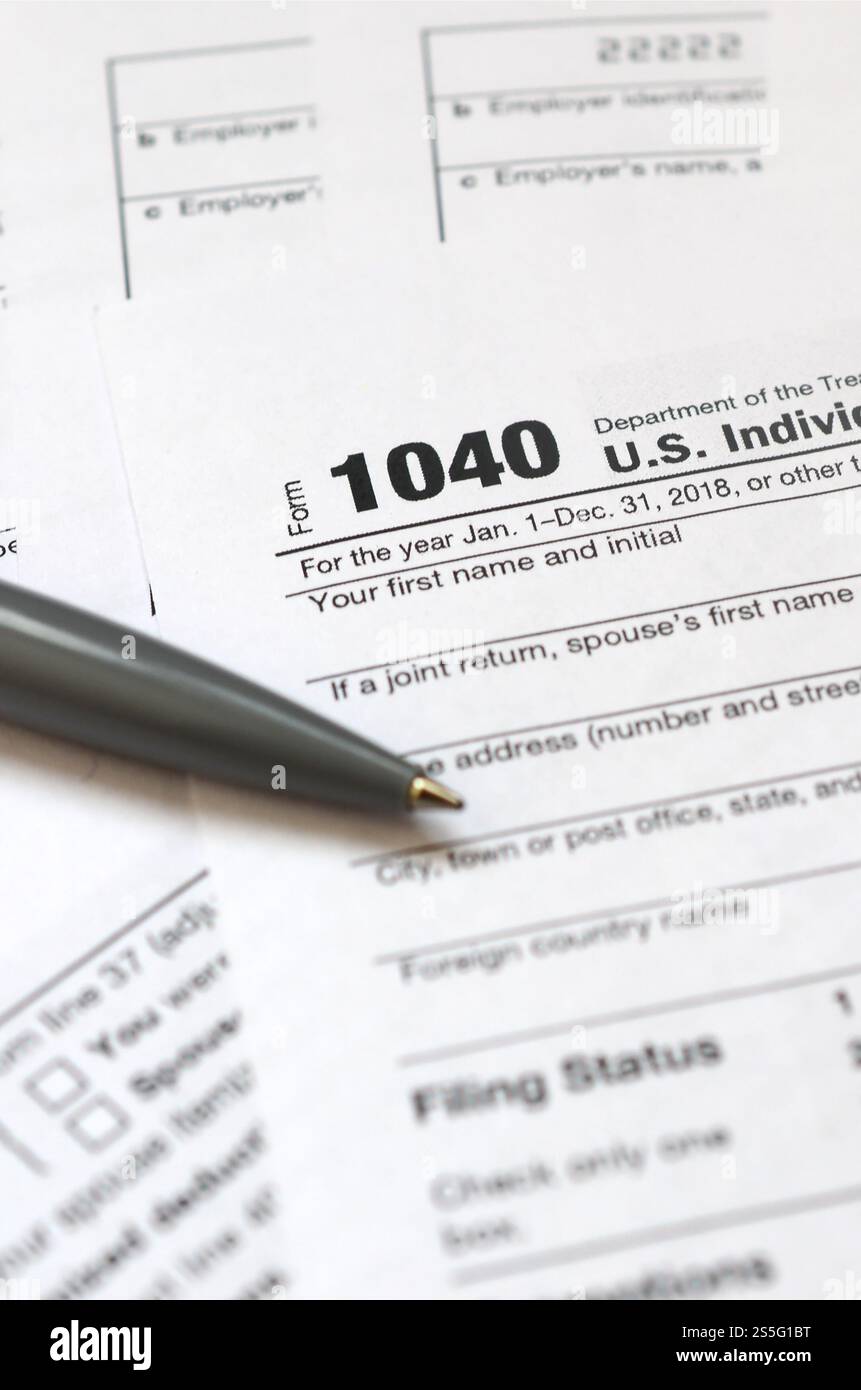 The pen lies on the tax form 1040 U.S. Individual Income Tax Return ...