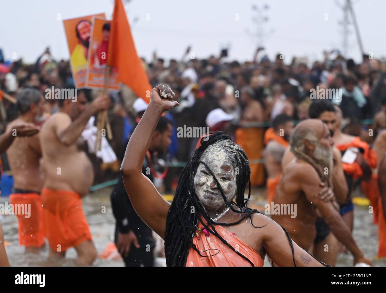 PRAYAGRAJ, INDIA - JANUARY 14: Female Sanyasini painted her face with ...