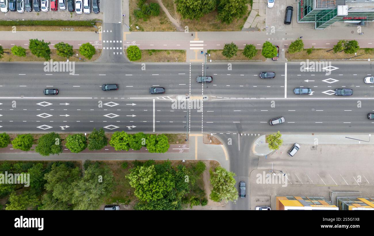 Aerial view of a busy urban intersection with multiple lanes and cars ...