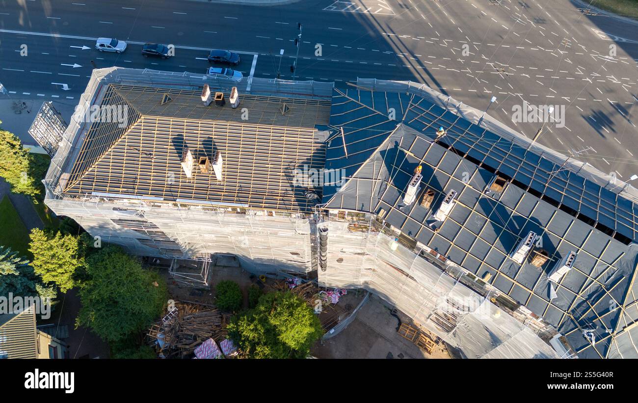 Aerial view of a building under construction with scaffolding and a ...