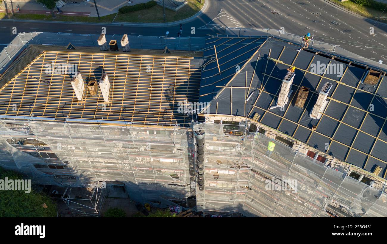 Aerial view of a building under construction with scaffolding and ...