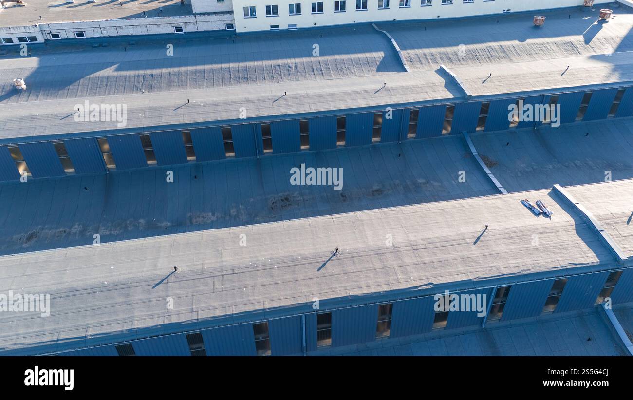 Aerial view of a large industrial building with a flat roof and ...