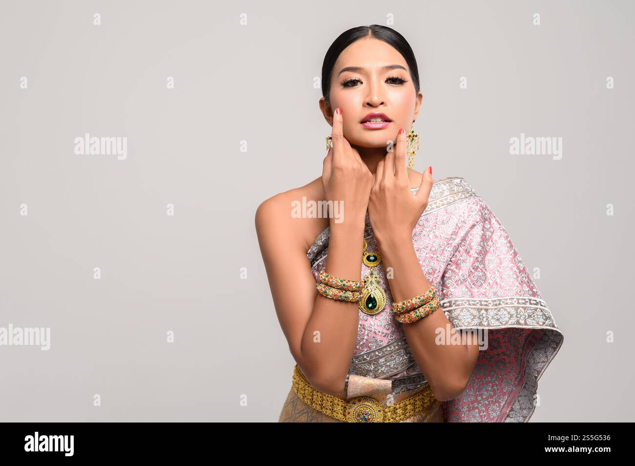 Women wearing Thai clothes and hands touching their faces Stock Photo ...