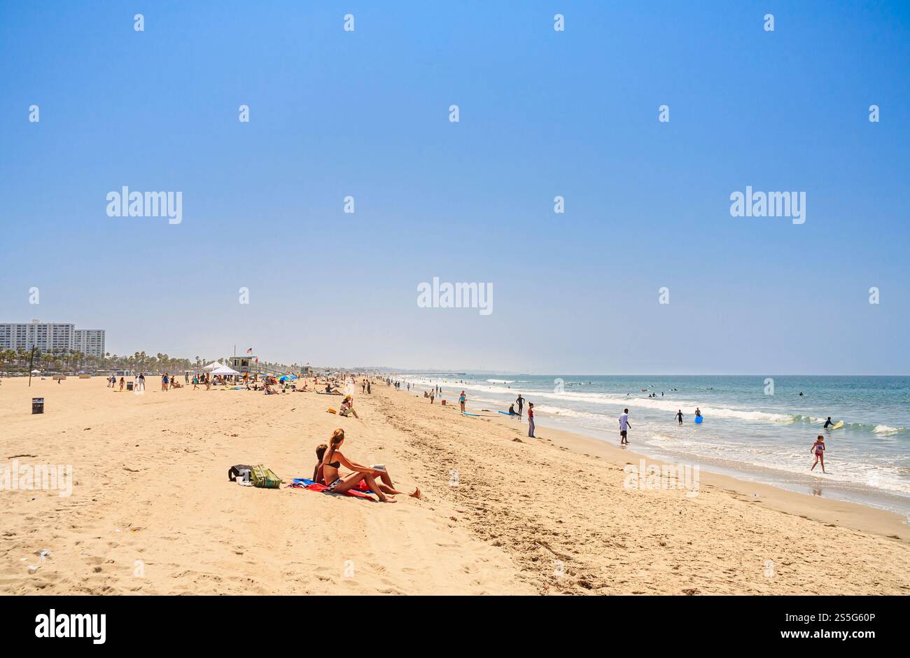 Sunbathers and tourists enjoy sandy Santa Monica beach in Los Angeles ...