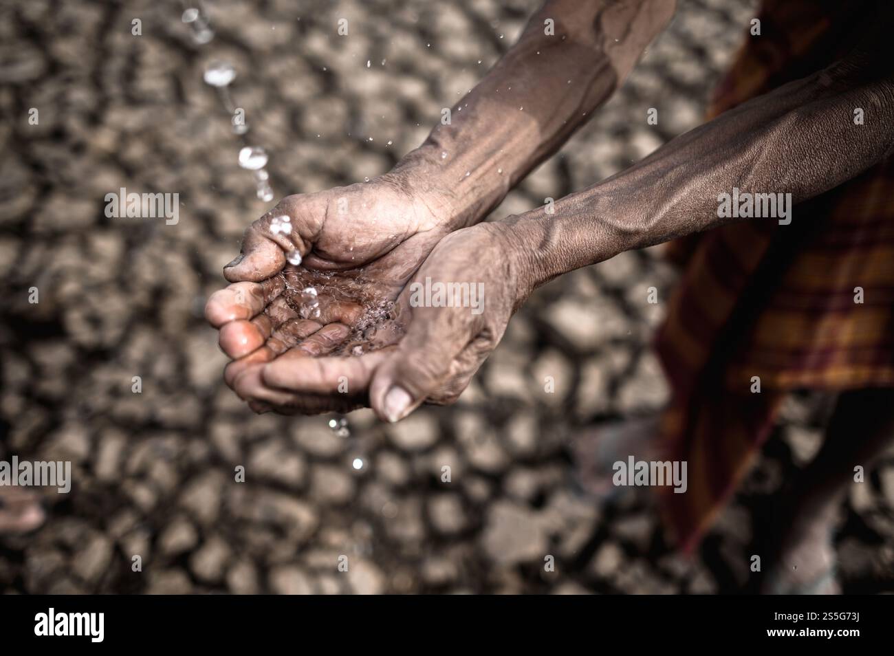 Elderly men are exposed to rainwater in dry weather,global warming,selective focus Stock Photo ...