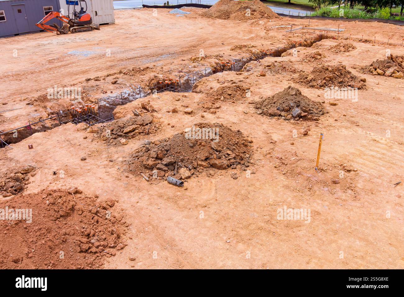 Large mounds of dirt and trenches indicate start of foundation work for ...