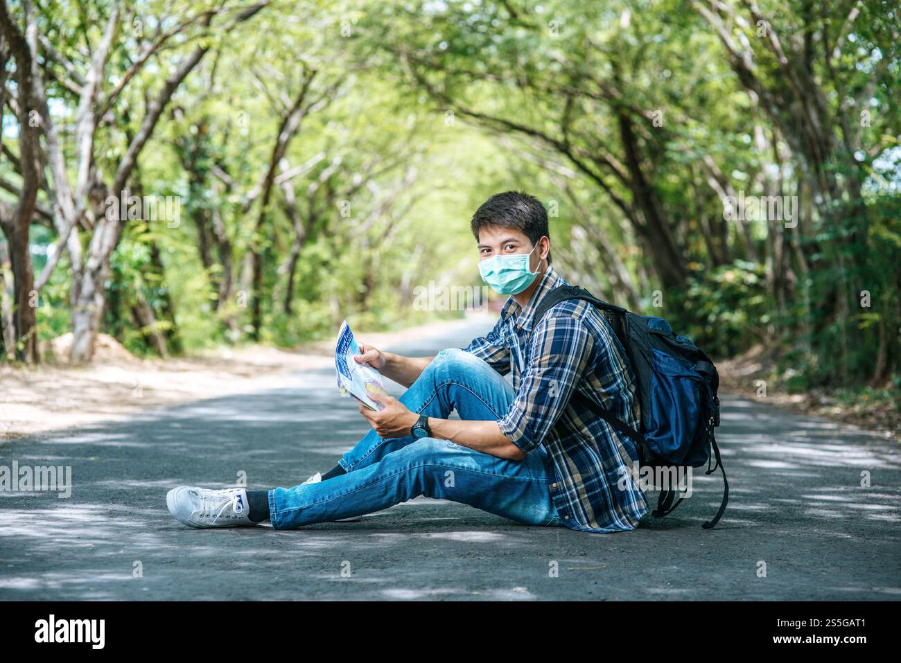 Male tourist sit on hi-res stock photography and images - Alamy