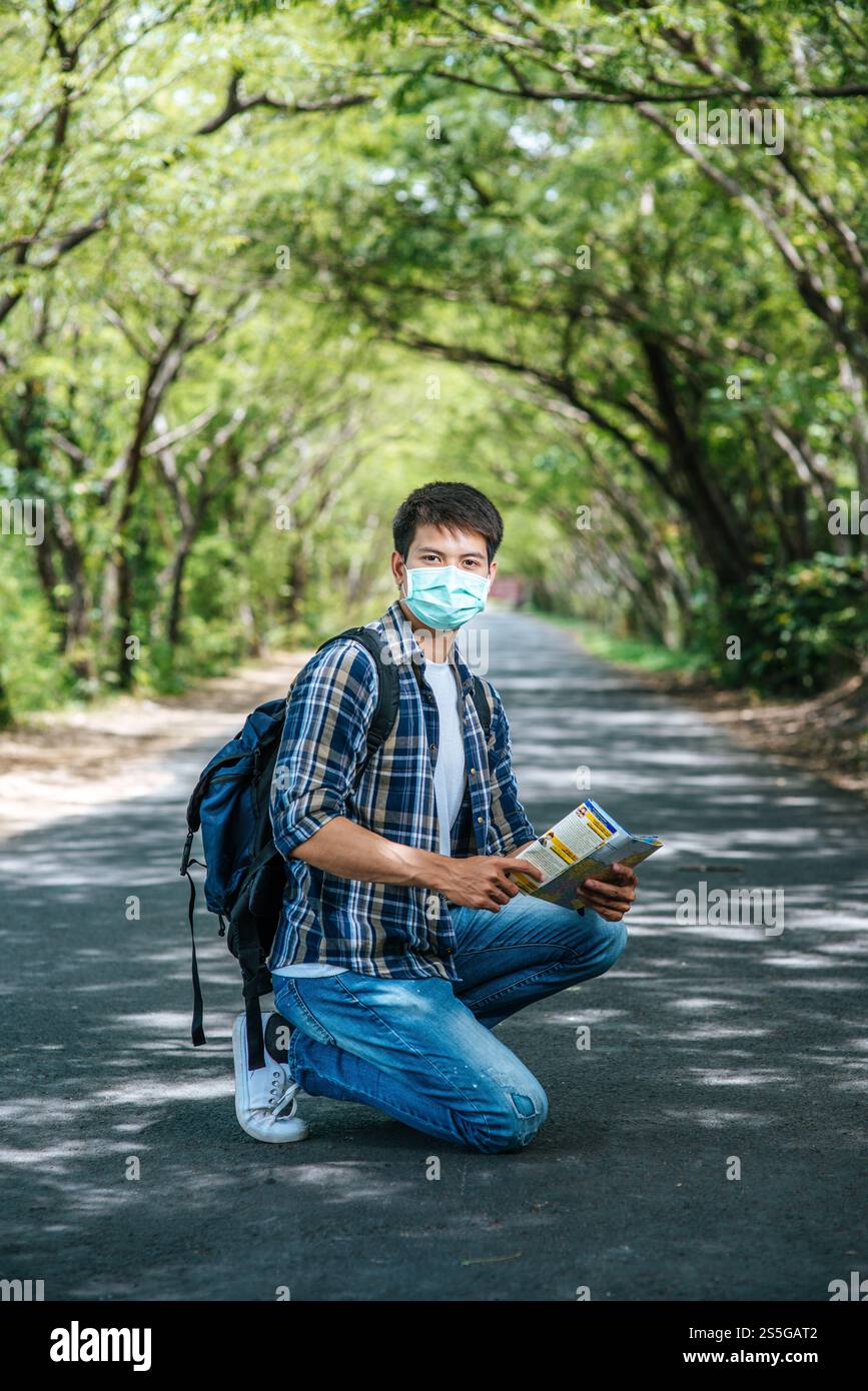 Male tourist sit on hi-res stock photography and images - Alamy