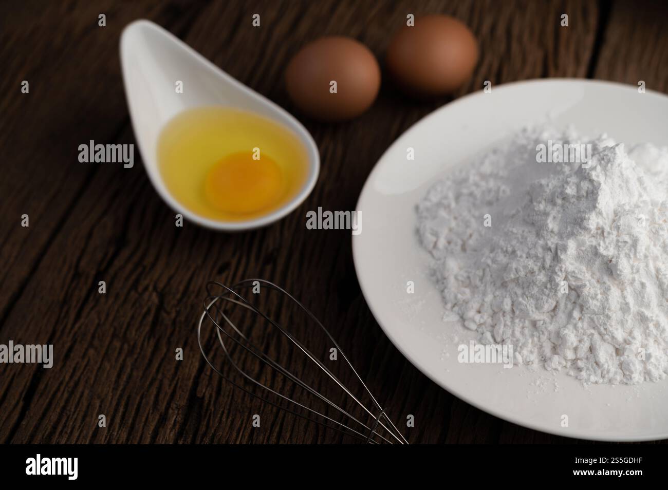 Eggs, tapioca flour and an egg beater, ingredients used in bakery Stock ...