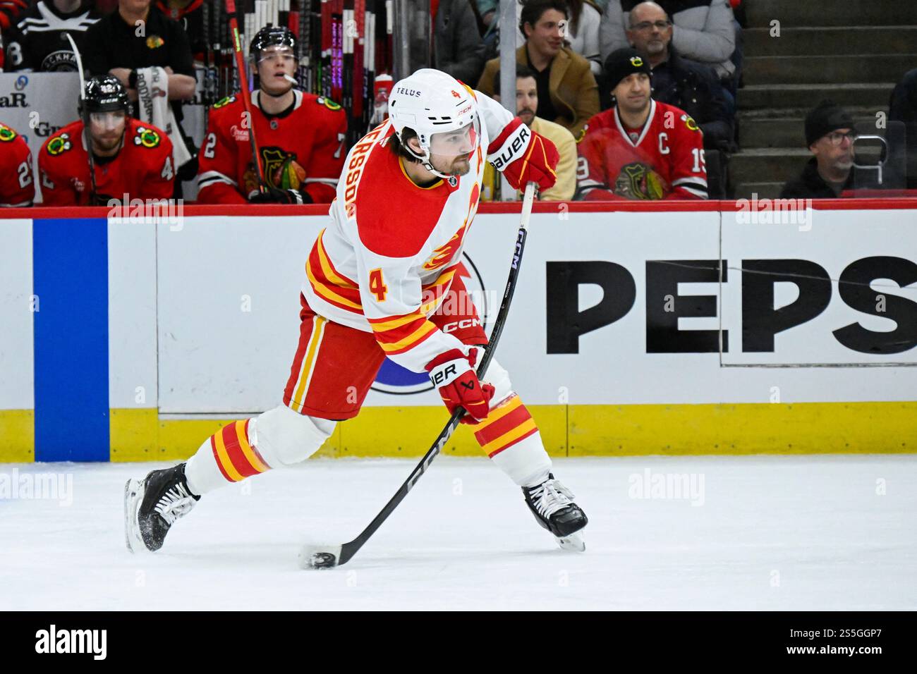 Calgary Flames defenseman Rasmus Andersson (4) shoots the puck against ...