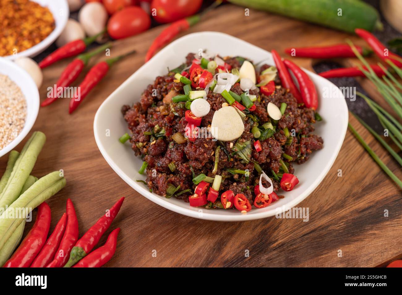 Spicy minced meat, made from raw meat with chili peppers. garlic and ...