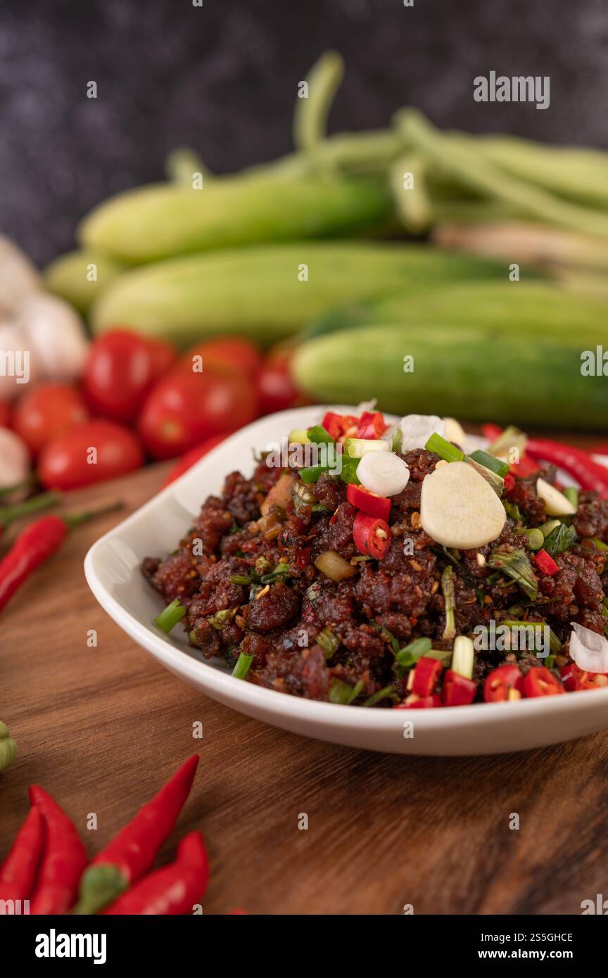Spicy minced meat, made from raw meat with chili peppers. garlic and ...