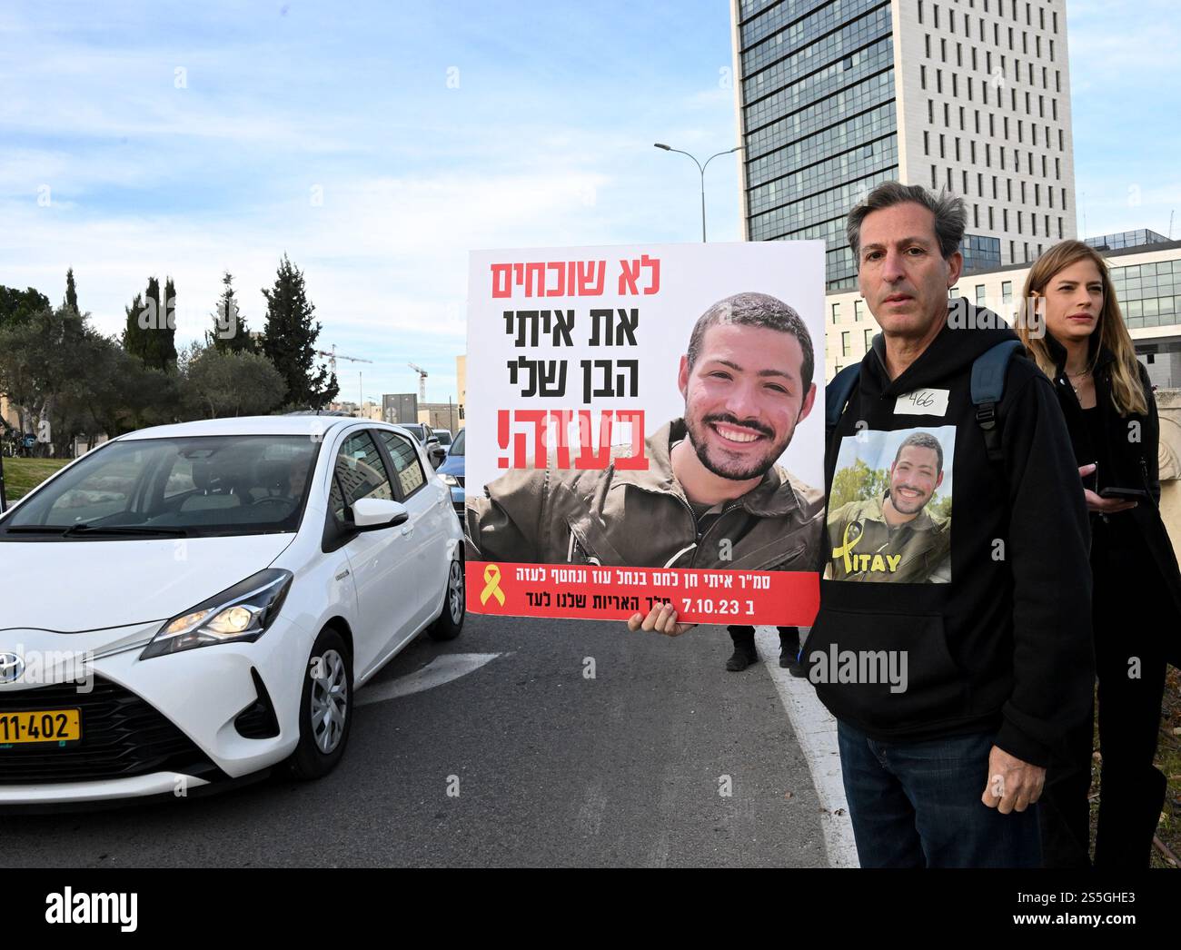 American-Israeli Ruby Chen holds a placard with a photo of his son Itay ...