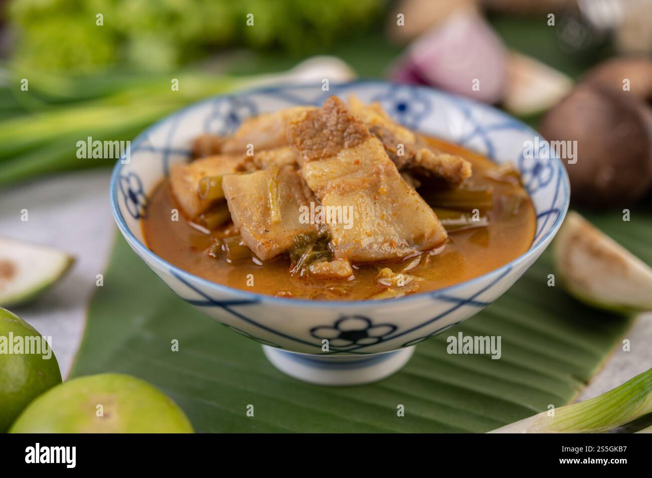 Red curry with pork belly and put morning glory in a ceramic cup. Thai ...