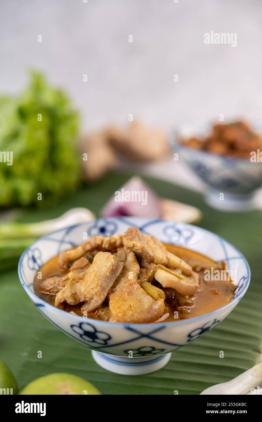 Red curry with pork belly and put morning glory in a ceramic cup. Thai ...