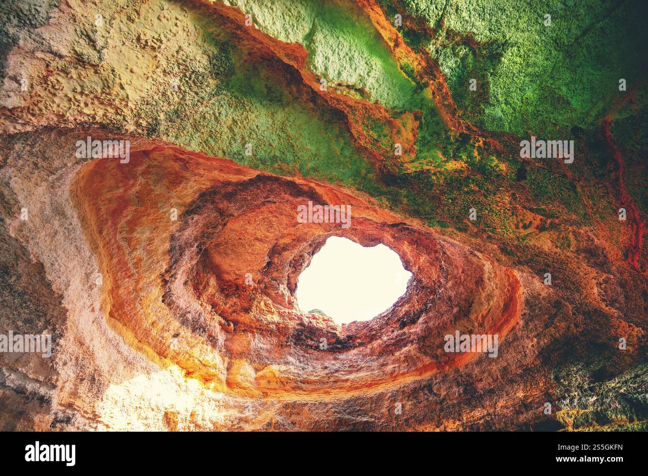 Coastal rocky seascape, hole of Benagil cave in Algarve region in ...