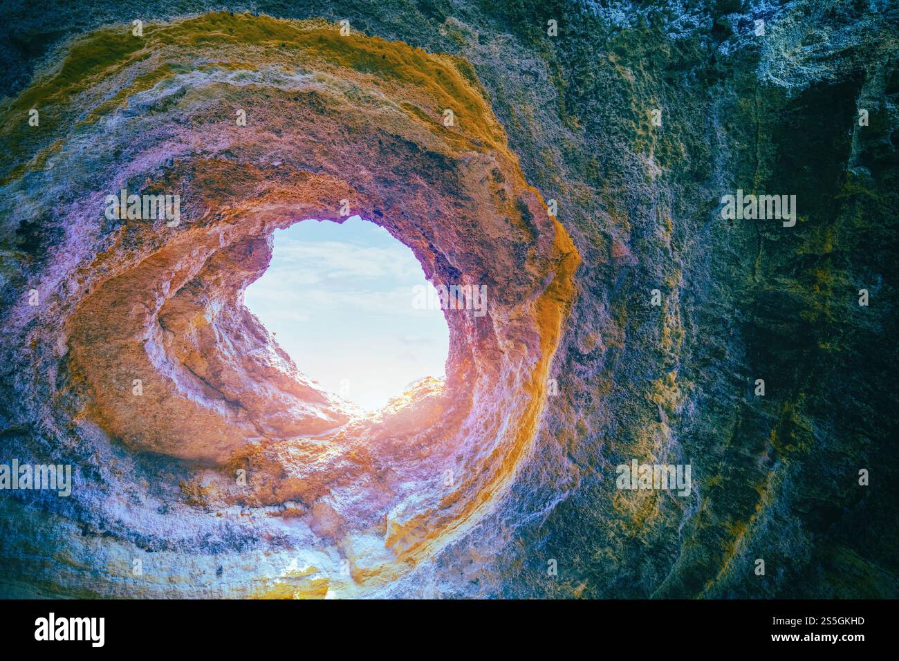 Coastal rocky seascape, hole of Benagil cave in Algarve region in ...