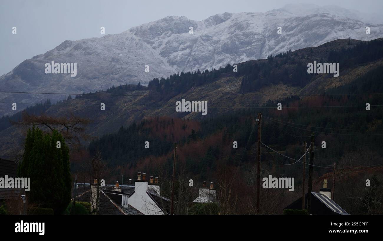 Snow-covered mountains in the winter countryside of the Scottish ...