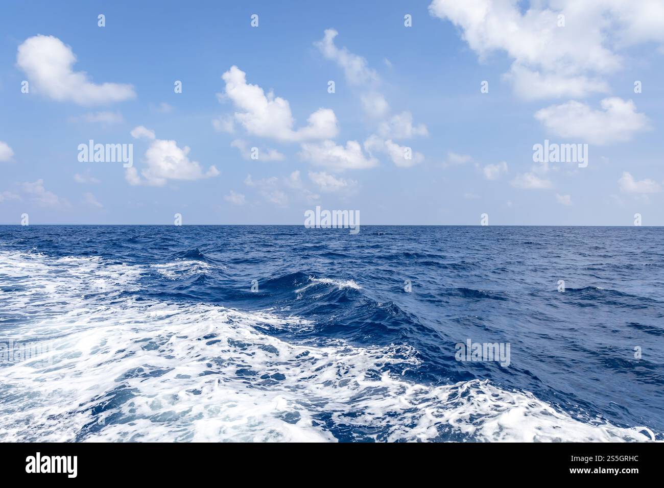 splash of ship water trails cutting through calm sea Stock Photo - Alamy