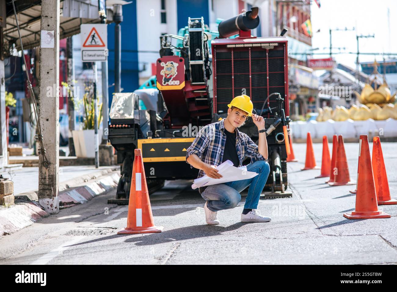 Civil engineers work on large road and machinery conditions Stock Photo ...
