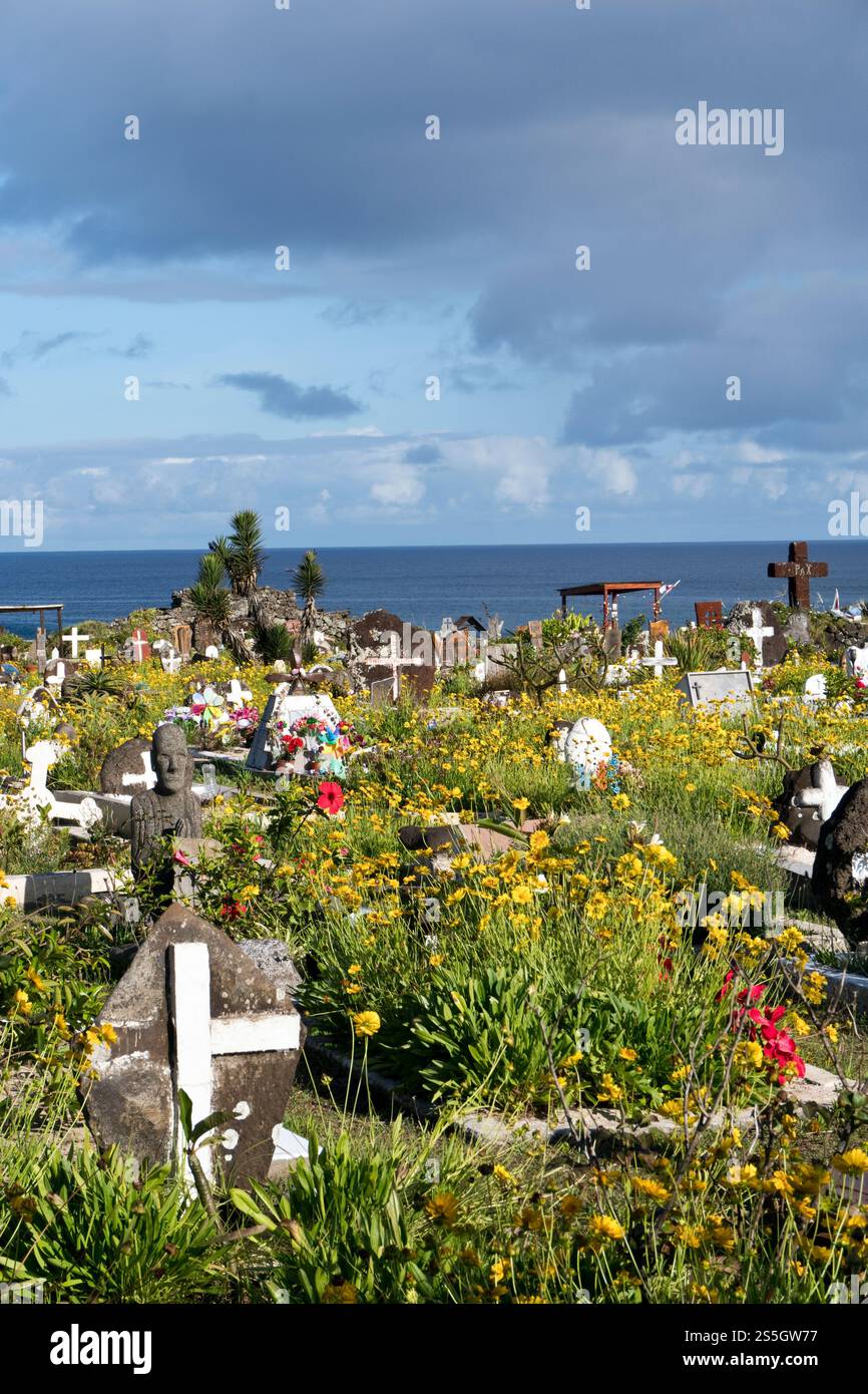 Graves in the Hanga Roa cemetery display Christian and native symbols ...