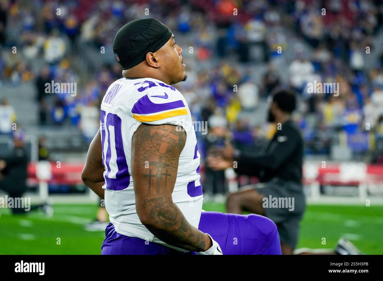 Minnesota Vikings fullback C.J. Ham (30) stretches before an NFL ...