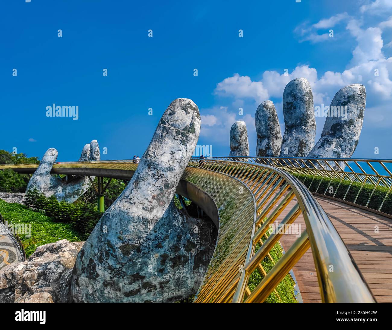 Golden Bridge in Ba Na hills, Da Nang, Vietnam on a sunny day. Lifted ...