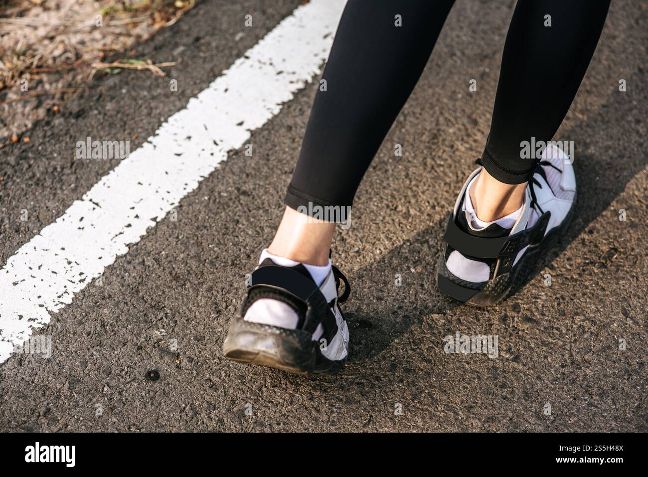 Runner woman feet running on road closeup on shoe. Sports healthy ...