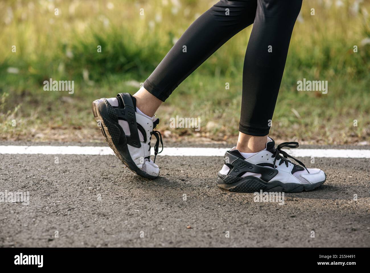 Runner woman feet running on road closeup on shoe. Sports healthy ...