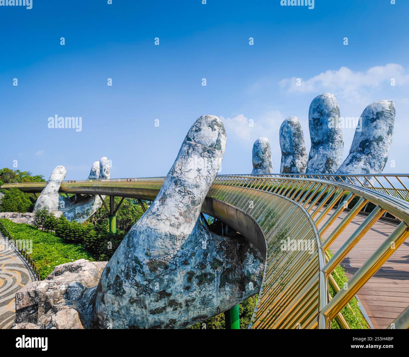 Golden Bridge in Ba Na hills, Da Nang, Vietnam on a sunny day. Lifted ...