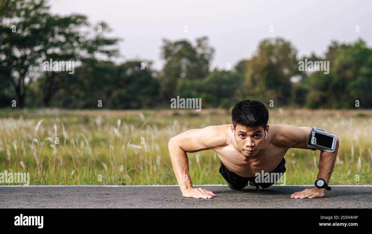 The men who removed the shirts had muscles push up the streets Stock ...