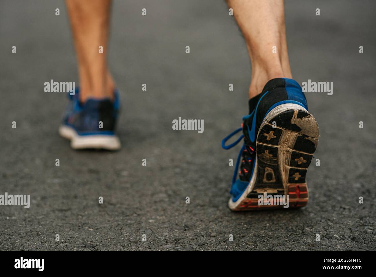Runner man feet running on road closeup on shoe. Sports healthy ...