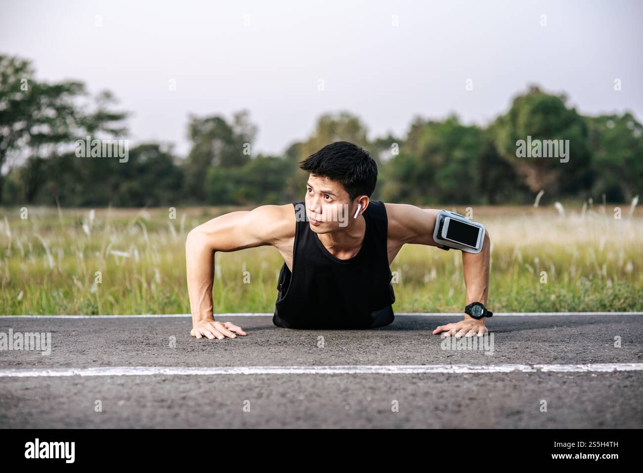 Men wear black shirts with muscles push up on the street Stock Photo ...