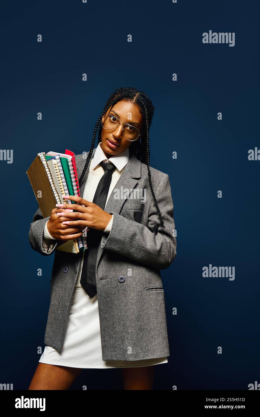 Confident young woman poses with books, flaunting her unique style ...