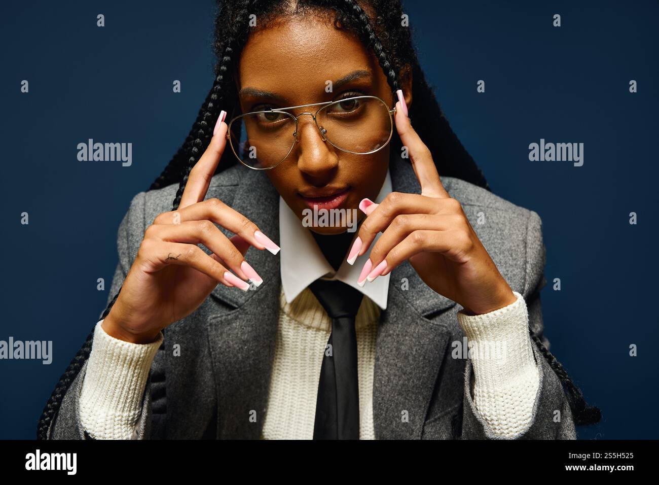 A young woman exudes confidence in her stylish outfit and bold ...