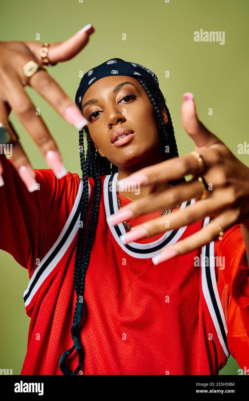 With expressive hands and a striking outfit, the woman radiates ...