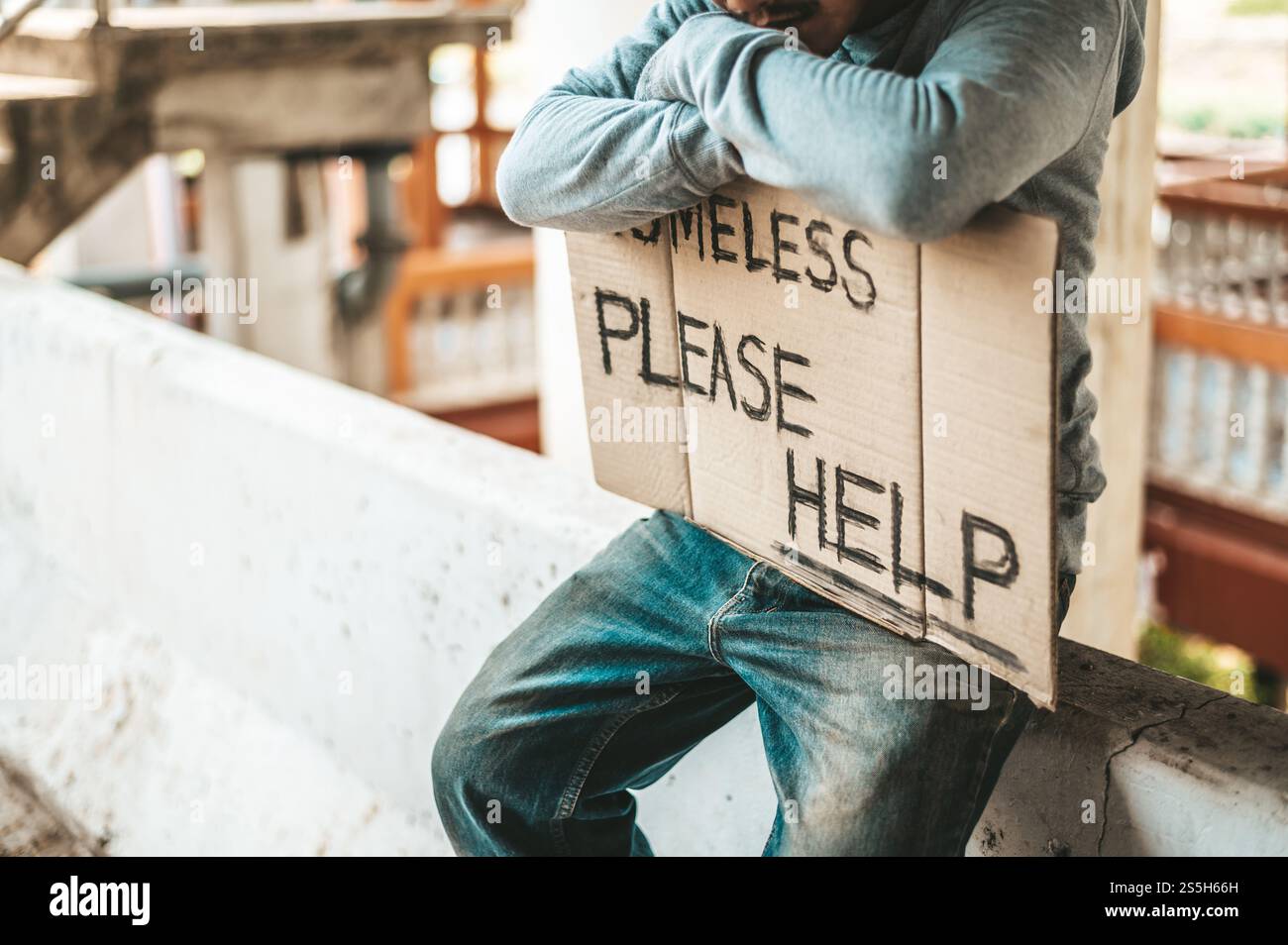 Beggar sit on barriers with homeless Please help messages Stock Photo ...