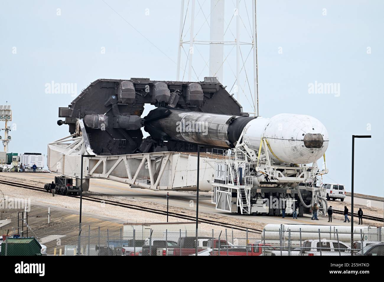 A SpaceX Falcon 9 rocket rolls from its horizontal integration facility to Pad 39A in ...